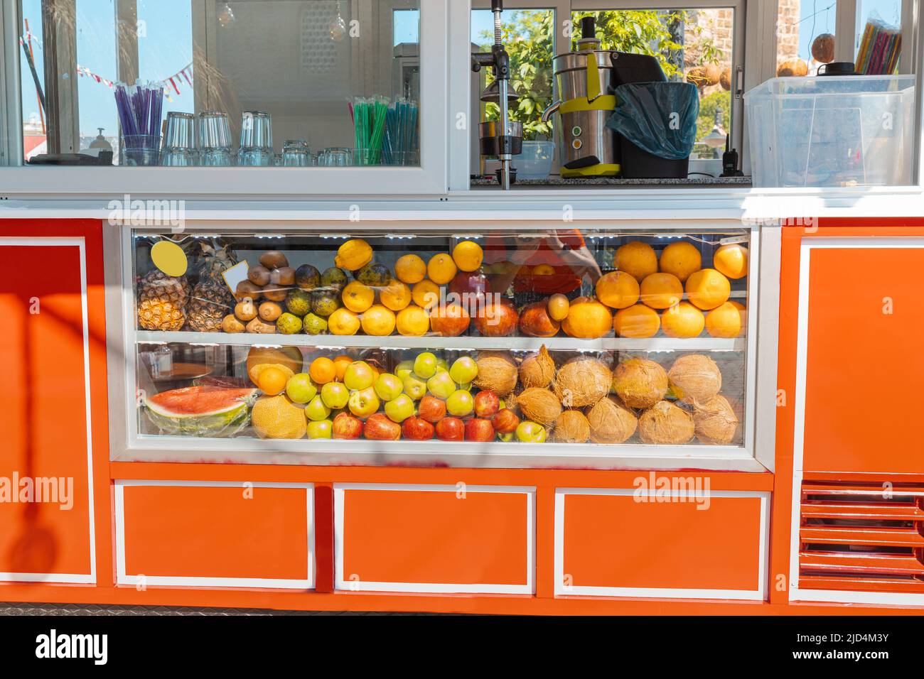 Juice and fruit shop stall at the city street. Retail small business ...