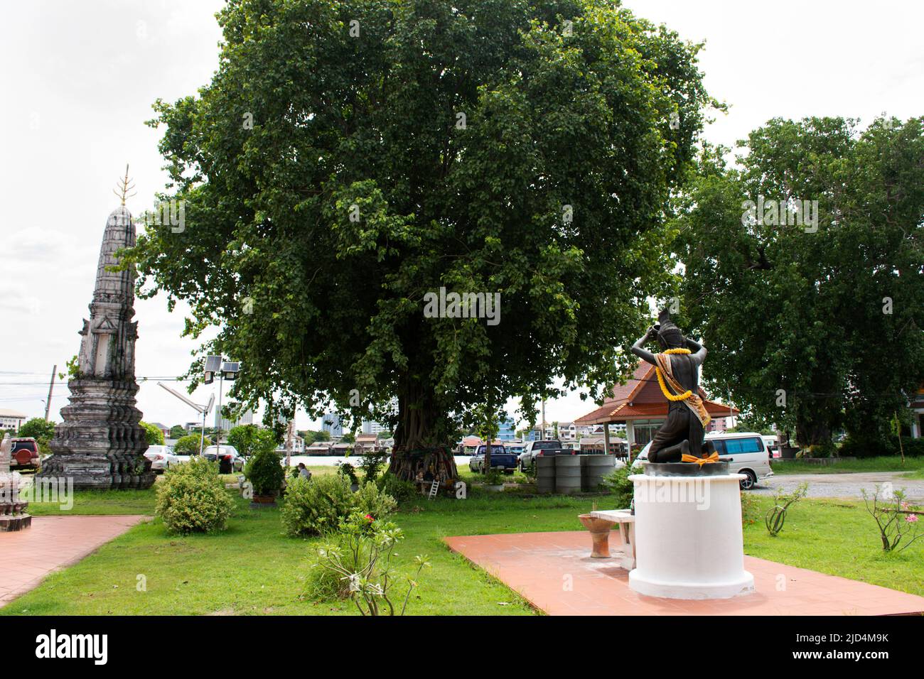 Ancient hermit or eremite statue with antique ruin stupa chedi for thai ...