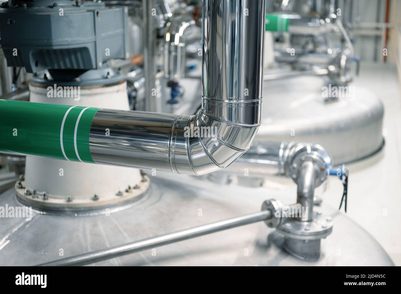 Complicated pipeline system in spacious workshop of plant Stock Photo ...