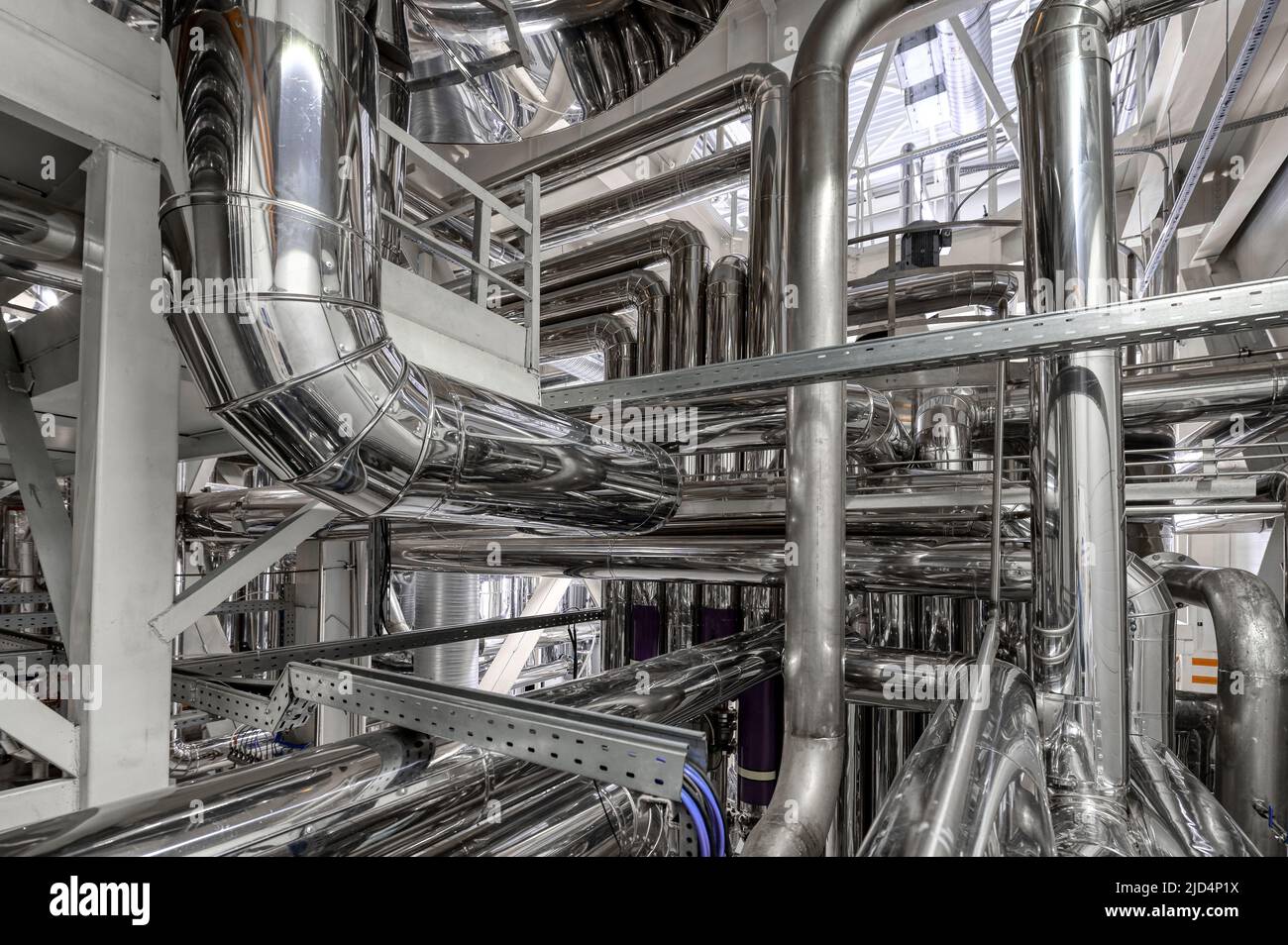 Complicated pipeline system in spacious workshop of plant Stock Photo ...