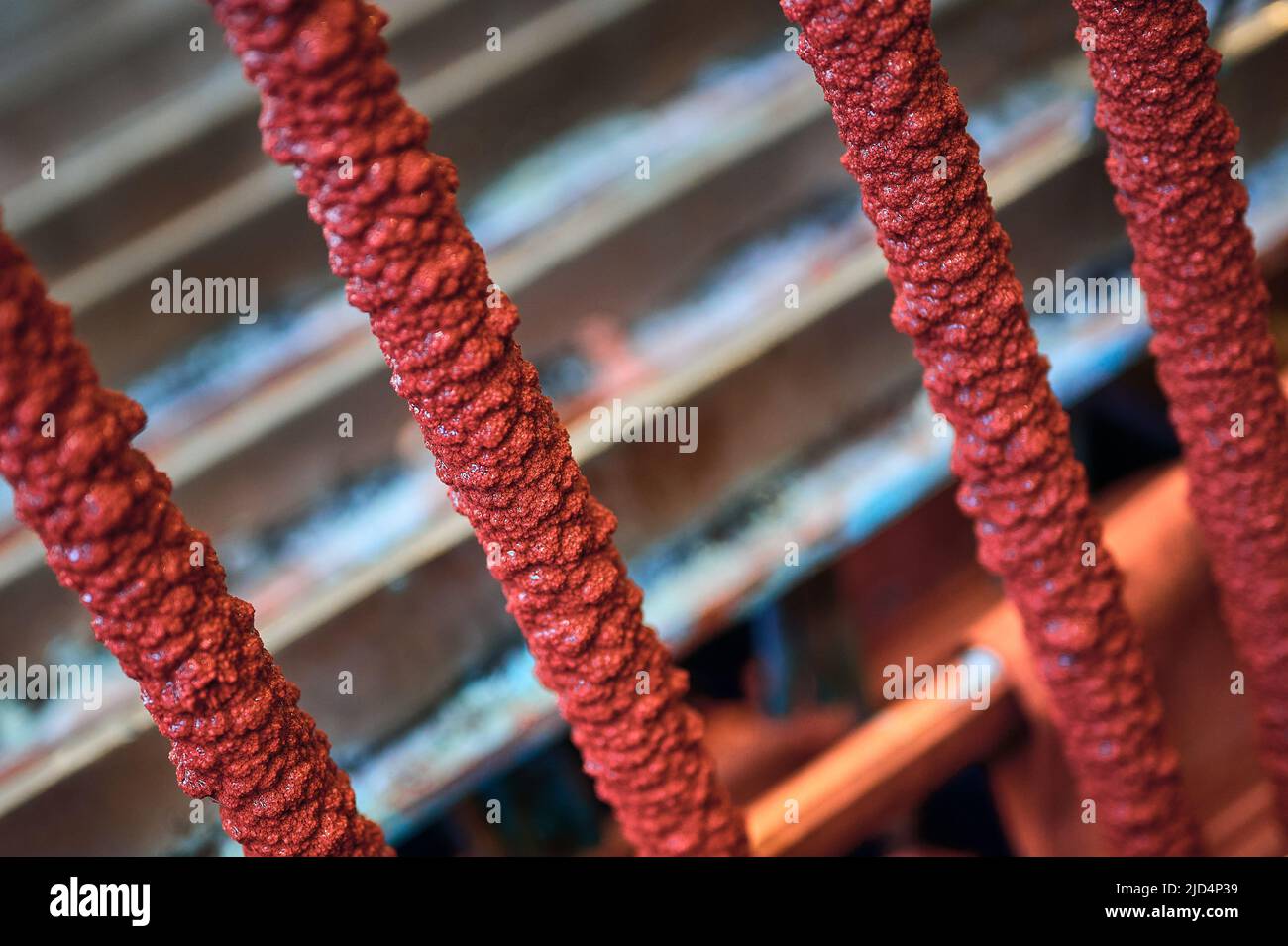 Red copper powder overgrowth on long metal cathode rods Stock Photo - Alamy