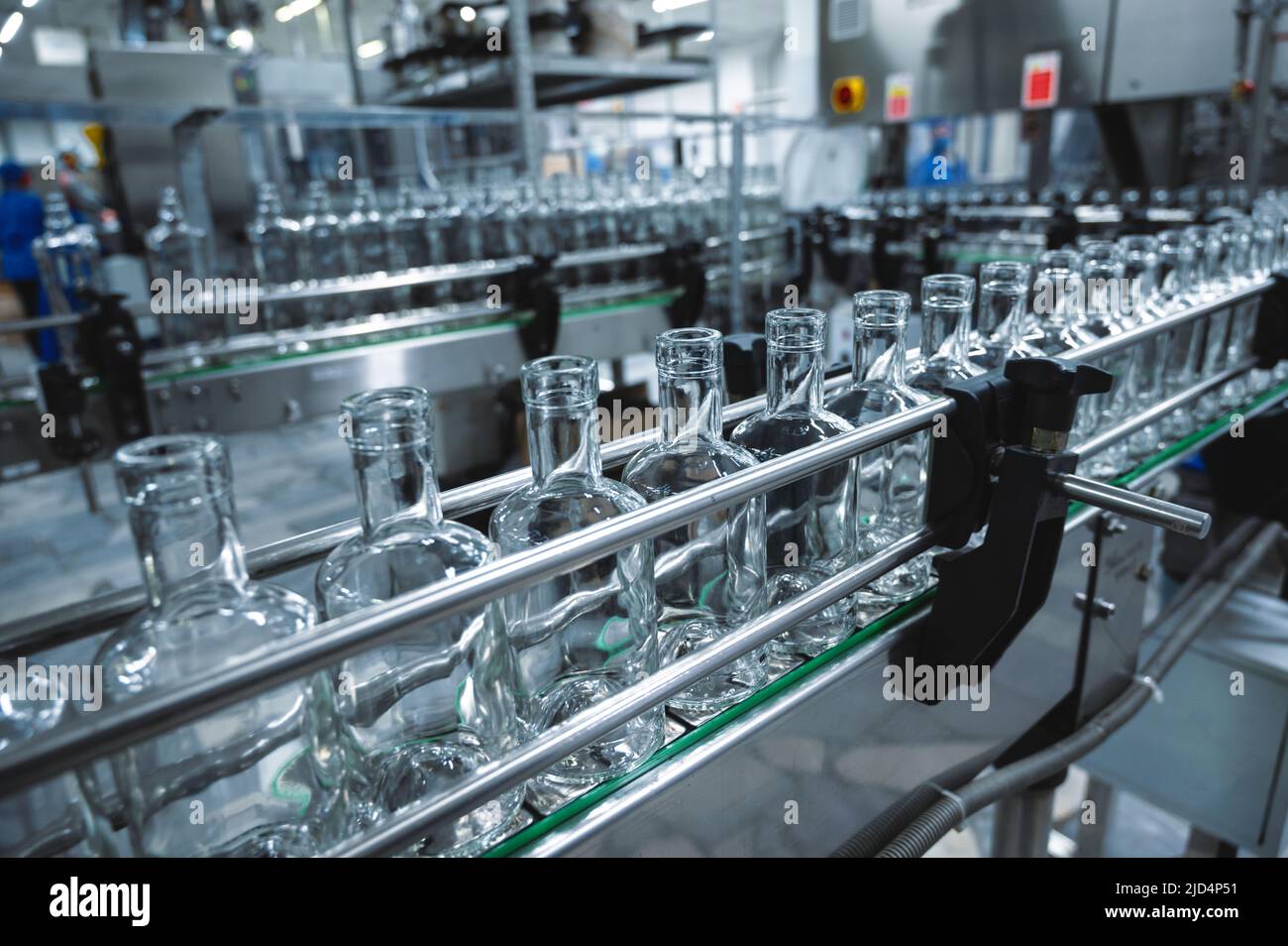 Production line transports empty glass bottles for alcohol Stock Photo ...