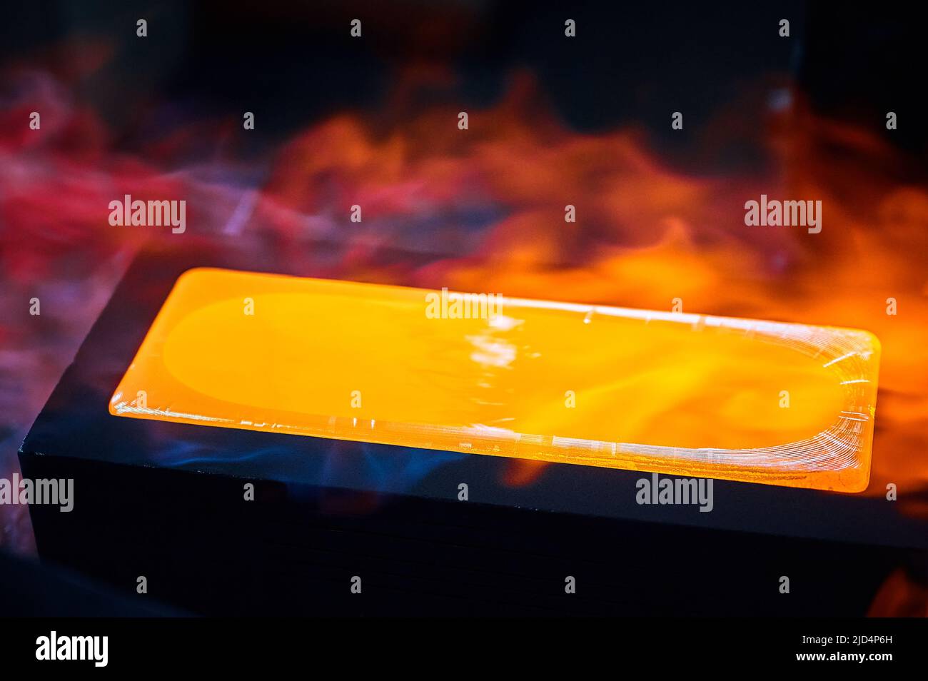 Hot gold ingot chills in casting form in shielding gases Stock Photo ...