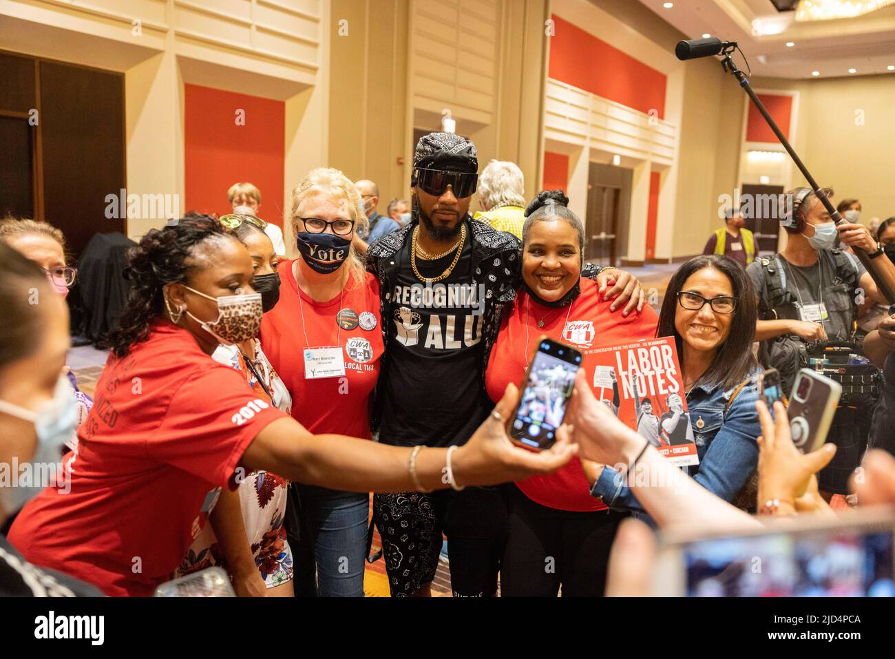 Labor leader Chris Smalls, center, president of Amazon Labor Union ...