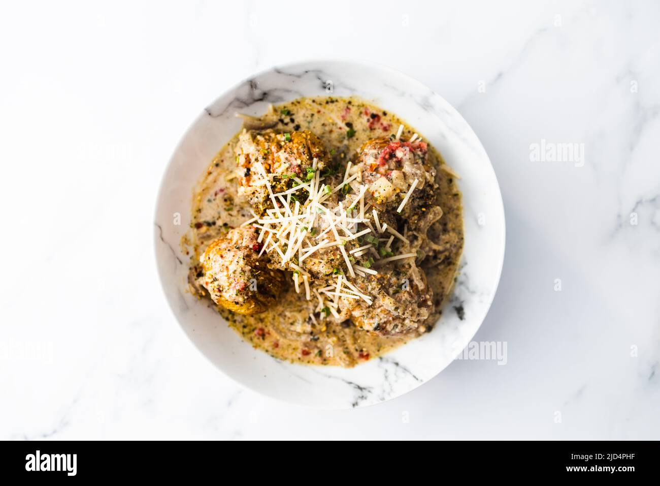 plant-based potato bake with dairy-free creamy sauce with chives nutmeg ...