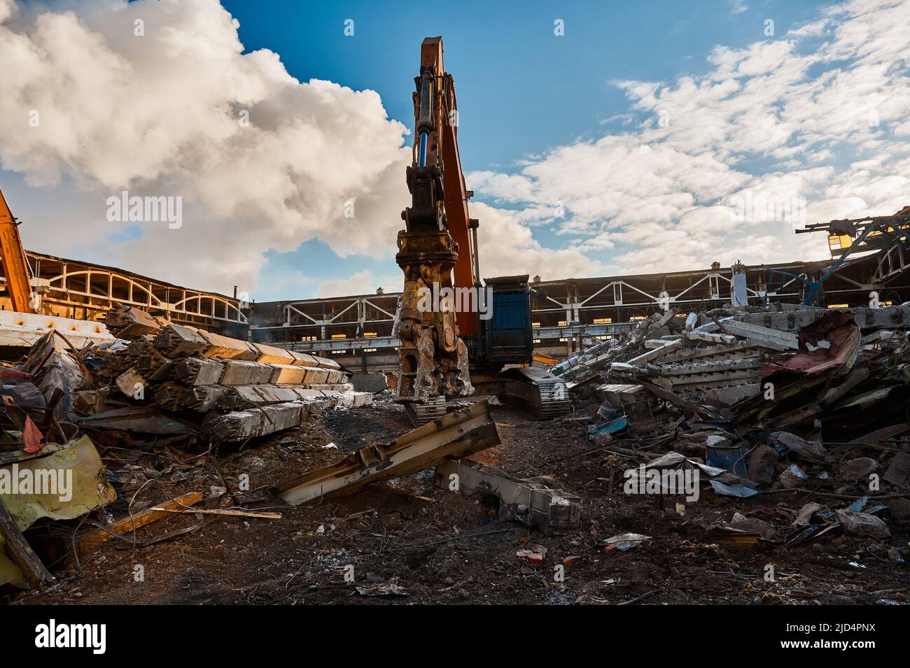 Excavator destroyer removes debris Building demolition Stock Photo - Alamy