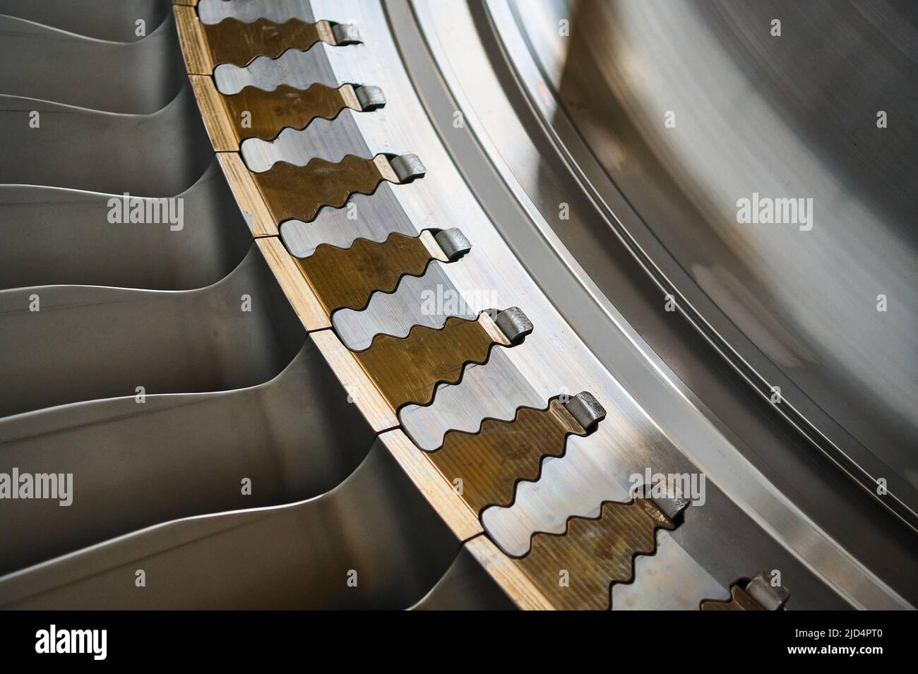 The rotor blades of a modern turbine, a close-up shot of the roots of ...