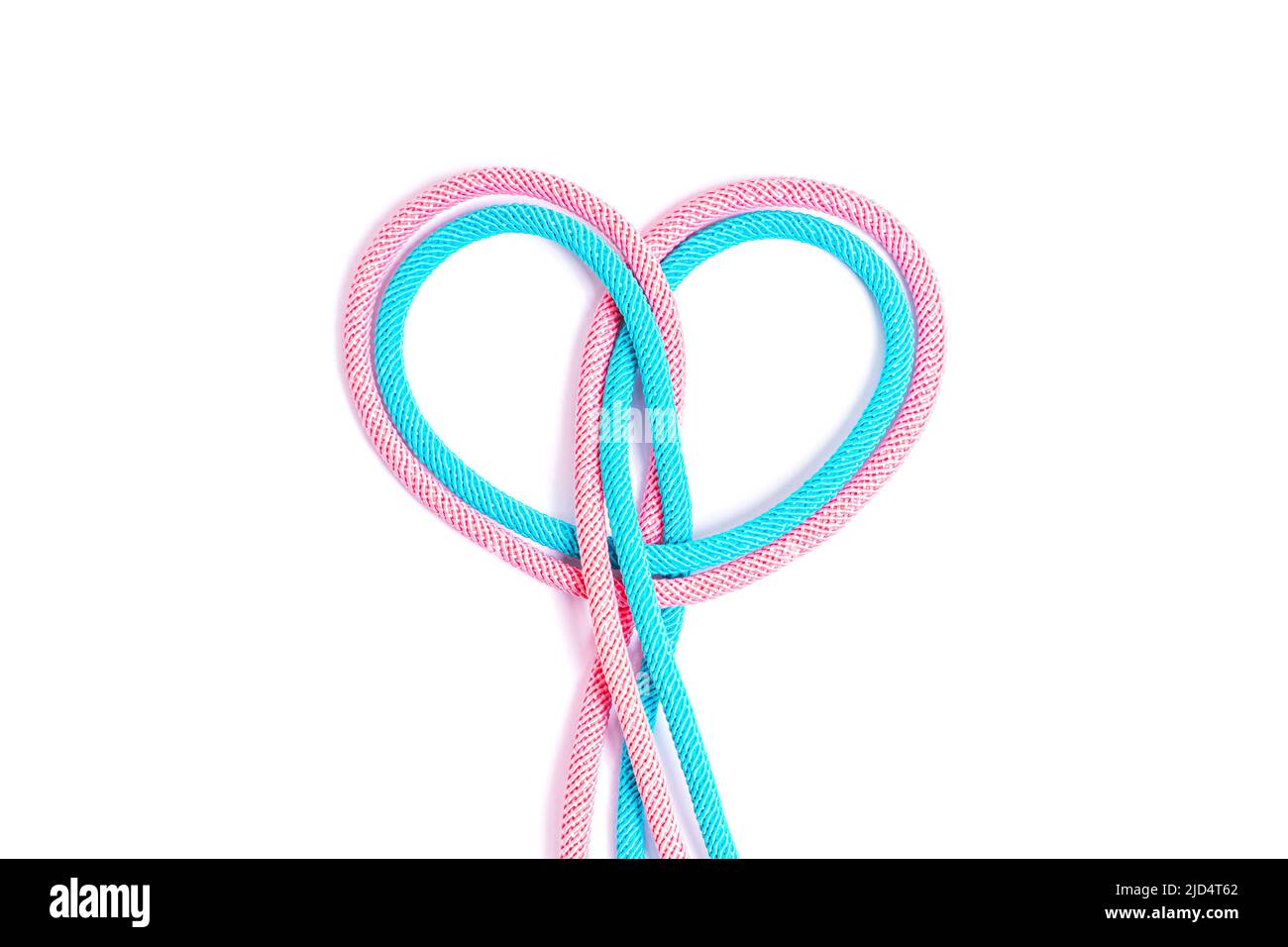 Heart symbol made from pink and blue cords isolated on gray background ...