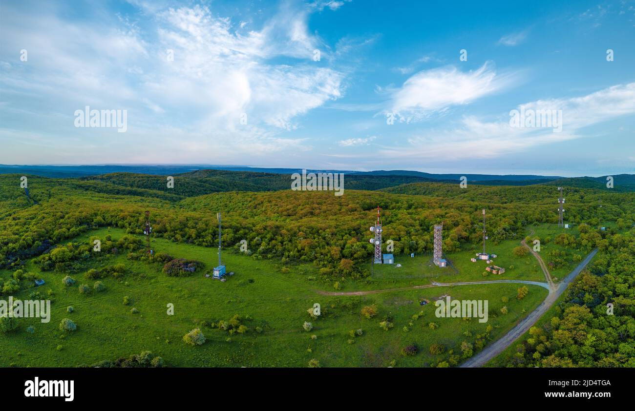 Panorama on bird's eye view of hills covered with green spring ...