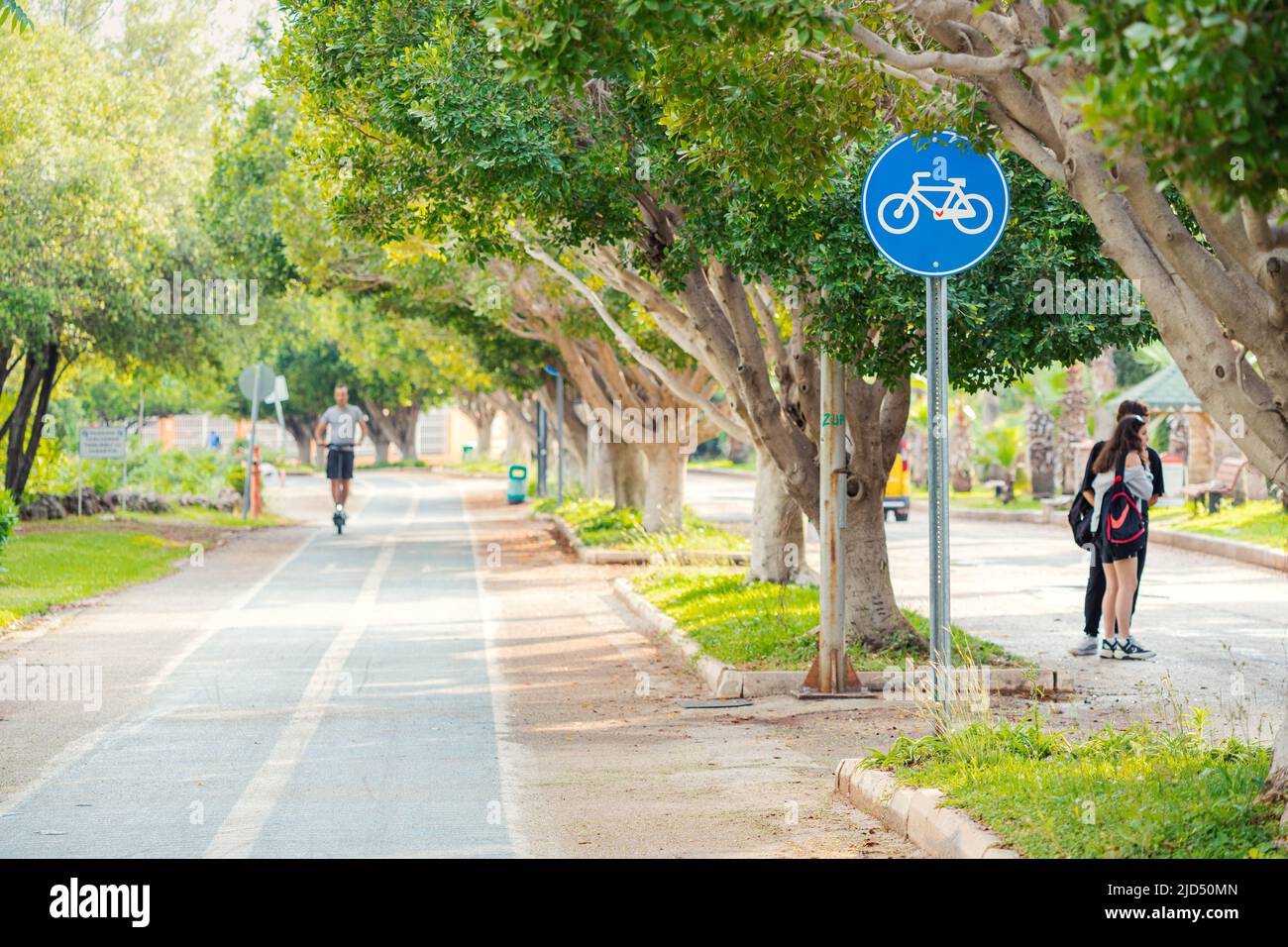 19 May 2022, Antalya, Turkey: Cyclists and scooters ride along a bike ...
