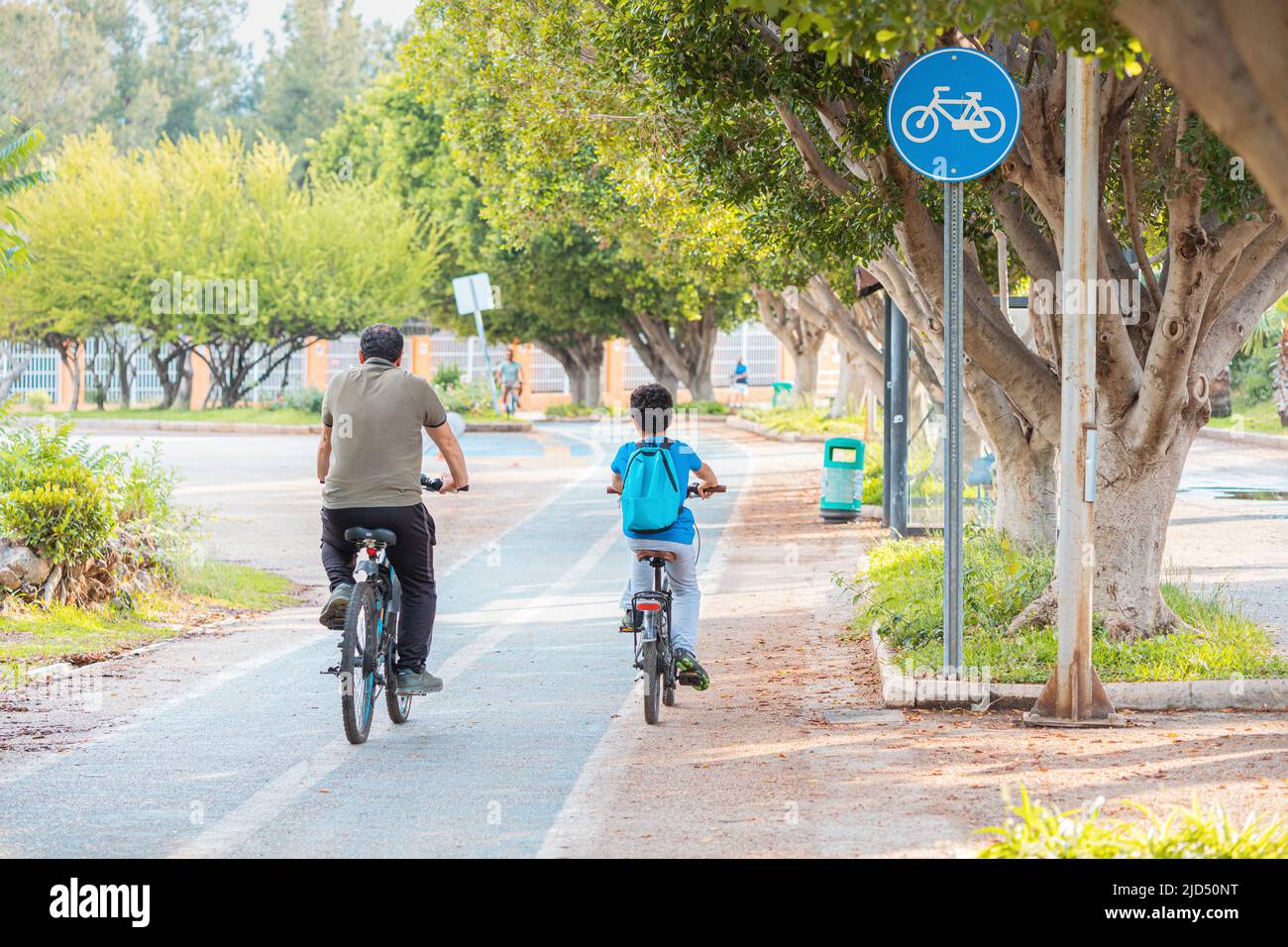 19 May 2022, Antalya, Turkey: Cyclists Dad and son ride along a bike ...