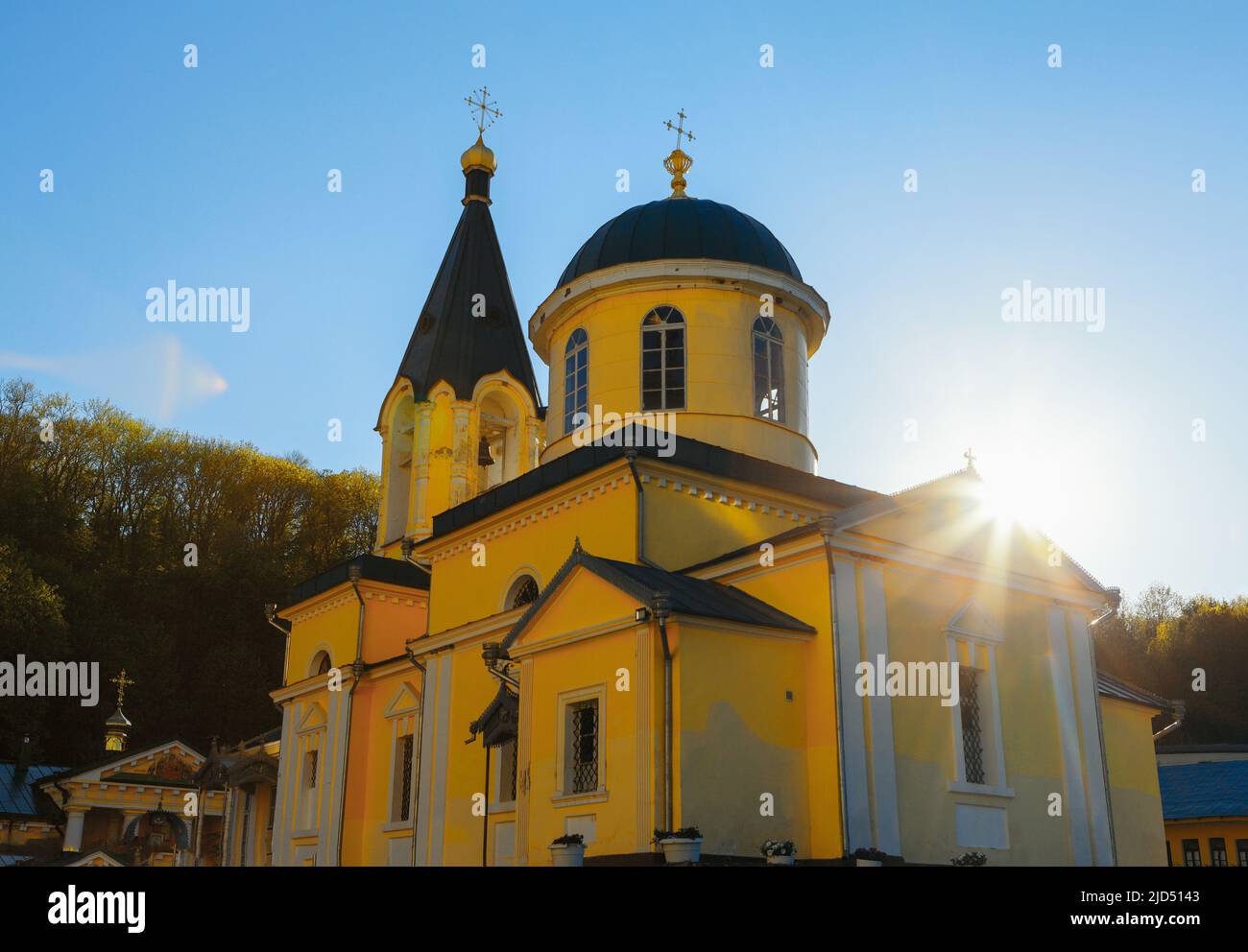 Church with sunlight . Sun rays over domes Stock Photo - Alamy