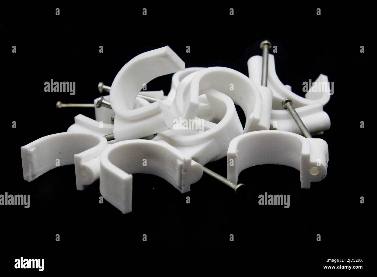 A picture of Cable Clips with Metal Nail Stock Photo - Alamy