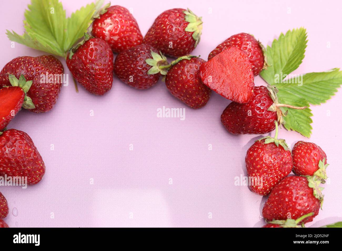 pink background with strawberry and copy space Stock Photo - Alamy