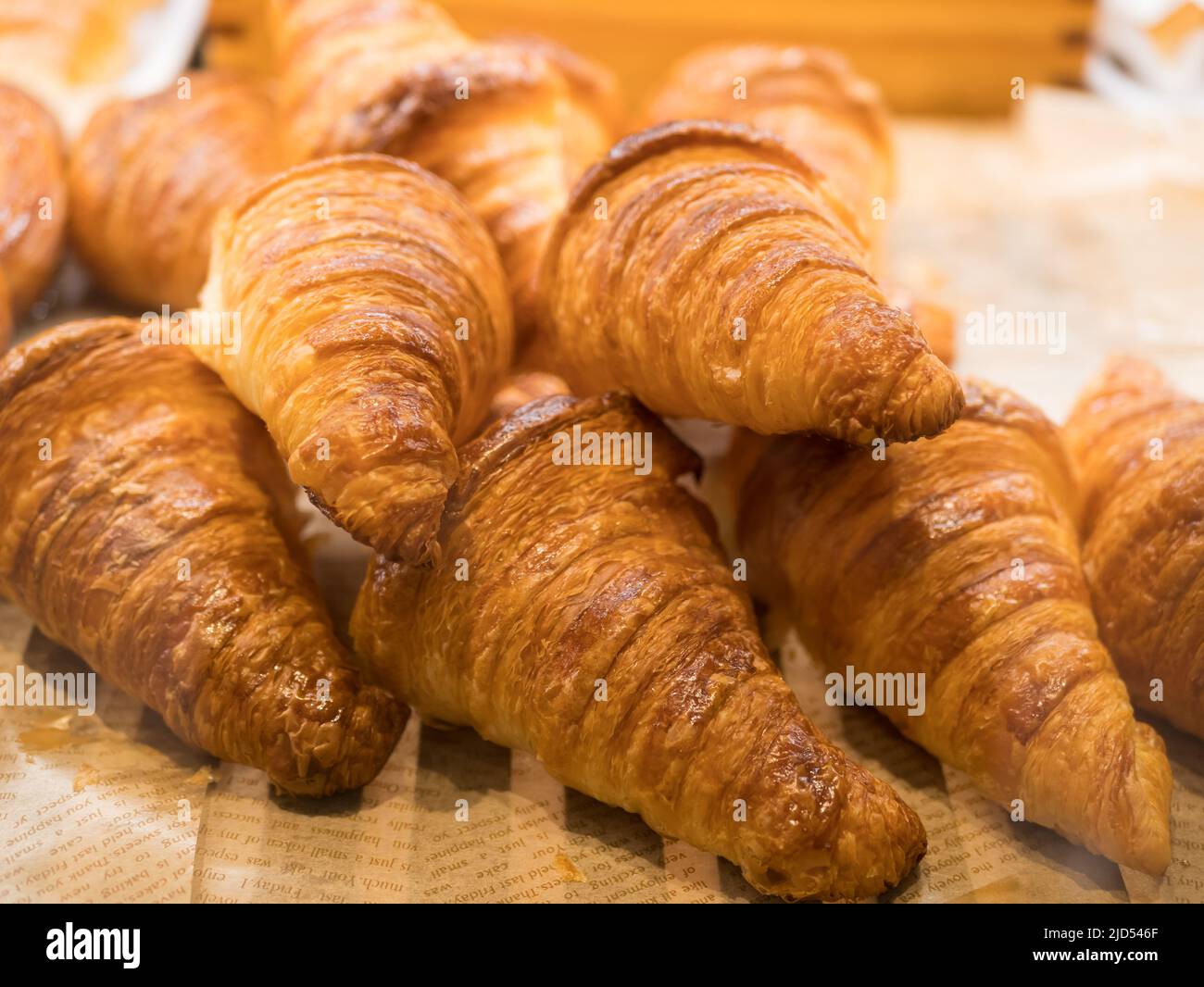 Tasty croissants on the tray sellin in the bakery shop Stock Photo - Alamy