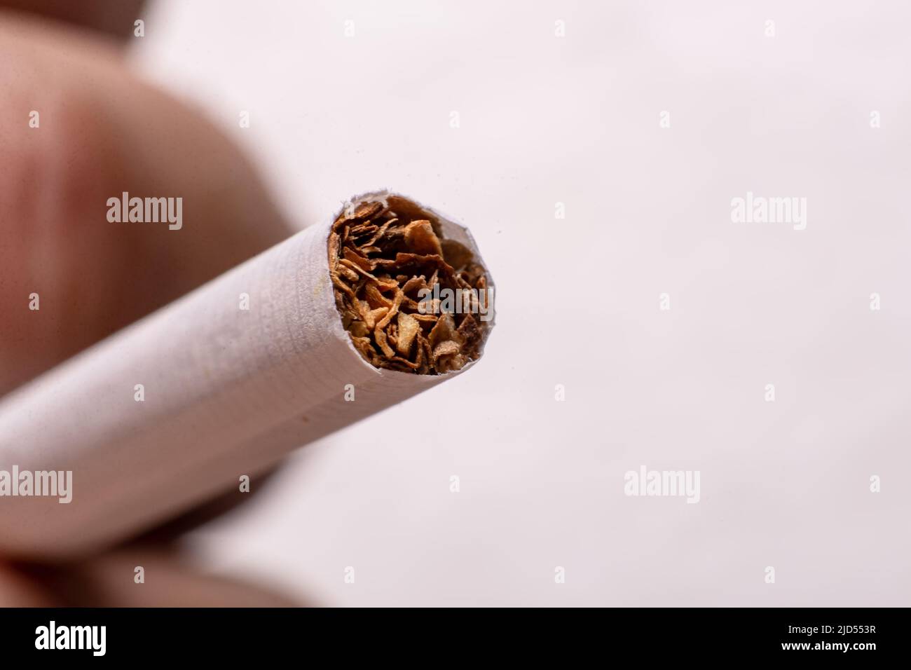 Cigarette close up on a white background Stock Photo - Alamy