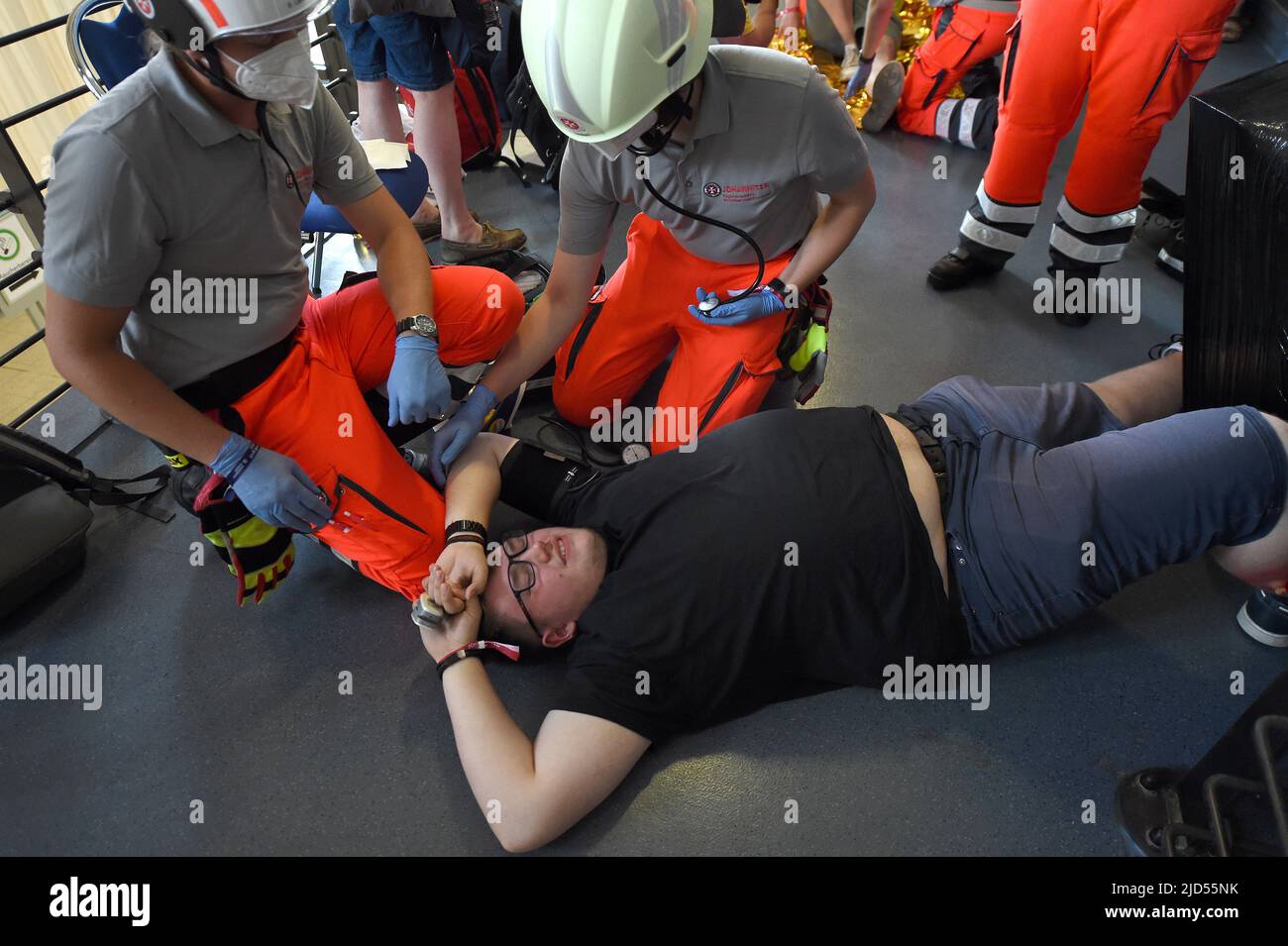 Essen, Germany. 18th June, 2022. First aiders attend to an injured ...