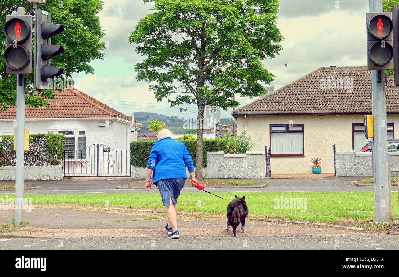 Glasgow, Scotland, UK June 18th 2022. UK Weather: Pedestrian walking ...