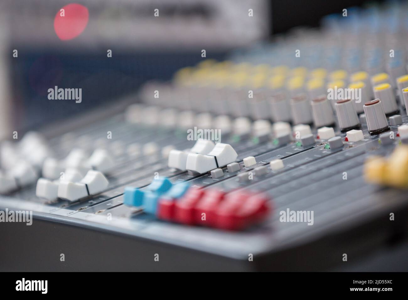Audio sound mixing system equipment hands fingers adjusting buttons ...