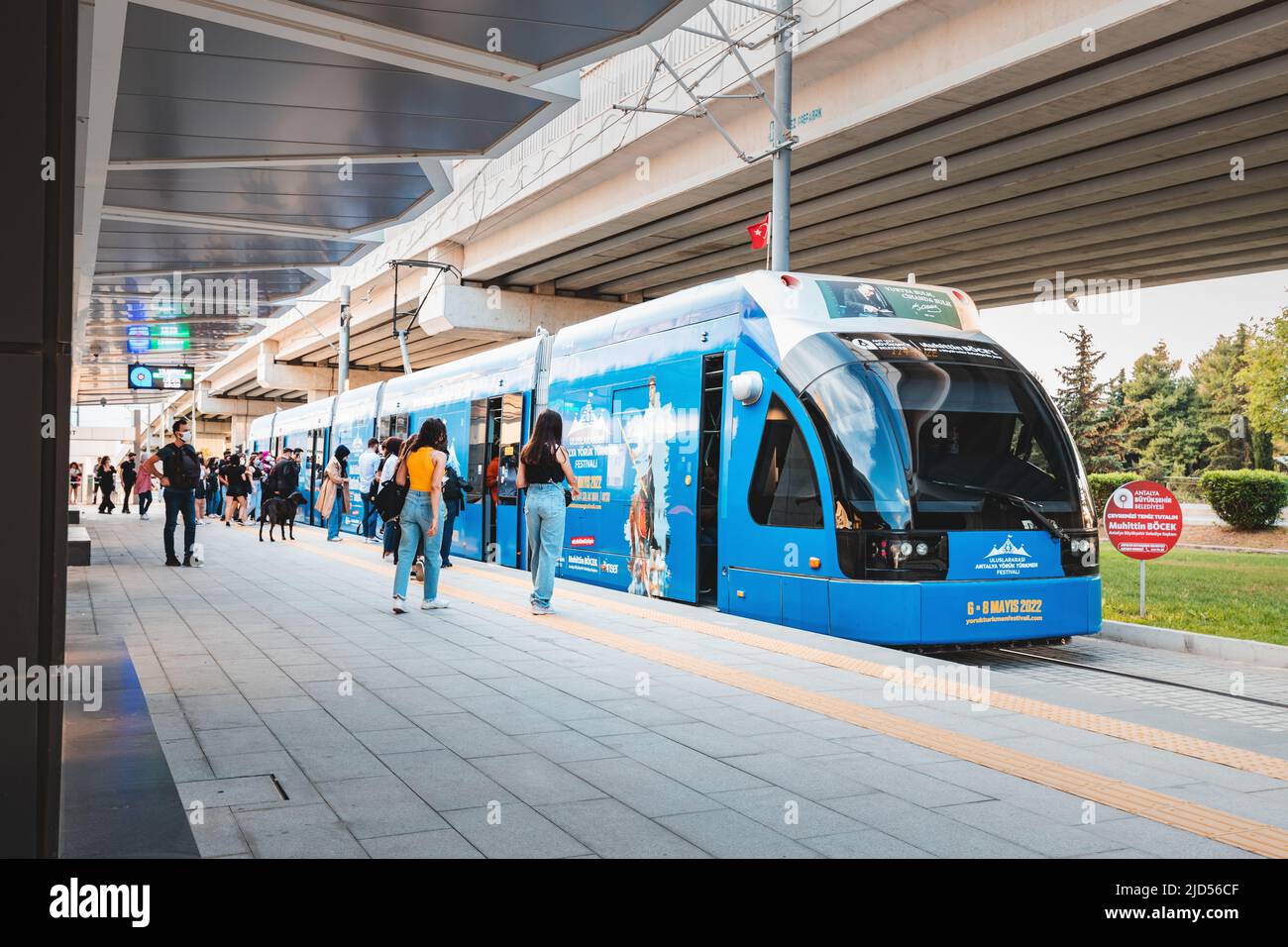 19 May 2022, Antalya, Turkiye: Electric eco tram at the stop boarding ...