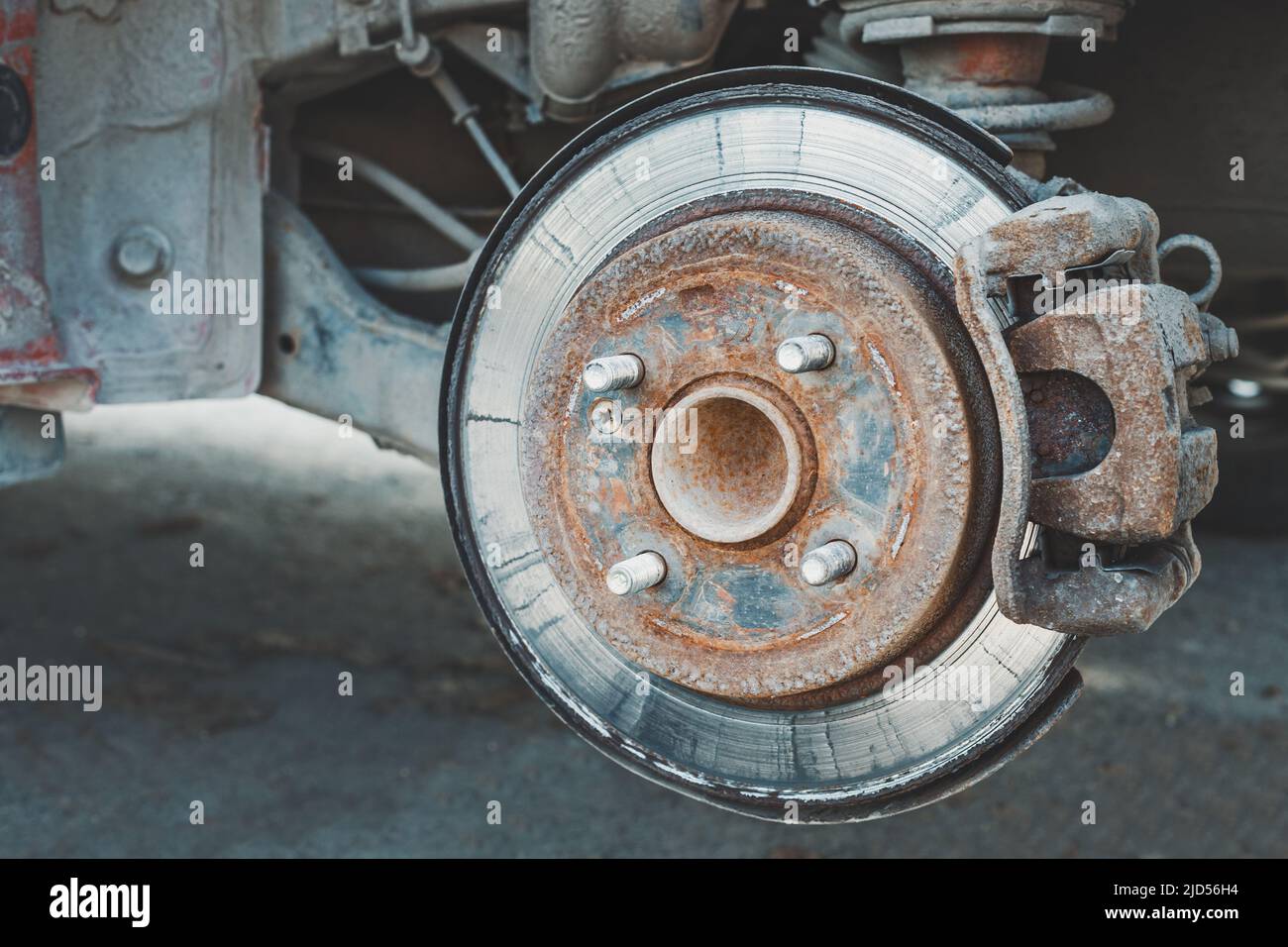 A rusty and old brake disc is serviced or replaced when the car is ...