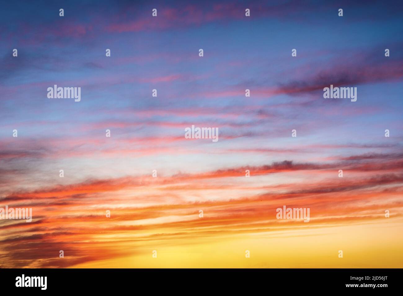 Bright and saturated sky with illuminated cirrus clouds as background ...