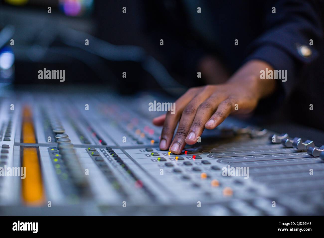 Audio sound mixing system equipment hands fingers adjusting buttons ...