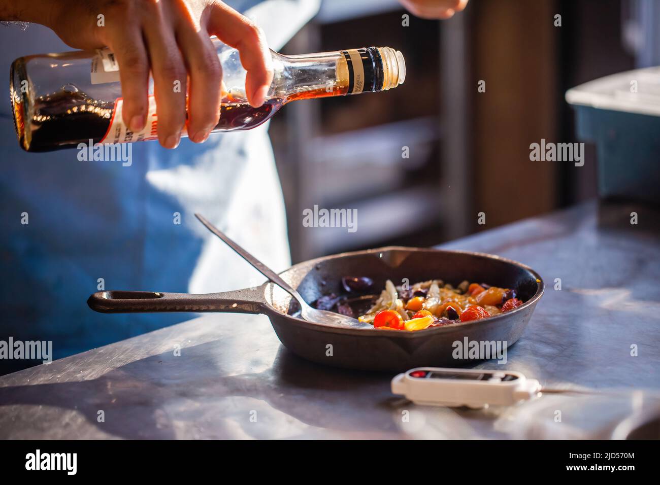Chef preparing food in restaurant kitchen. Gourmet chef in uniform ...