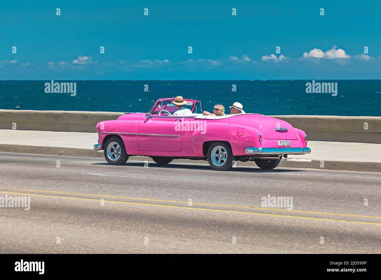 A beautiful pink vintage car on the famous Malecon in Havana, Cuba ...