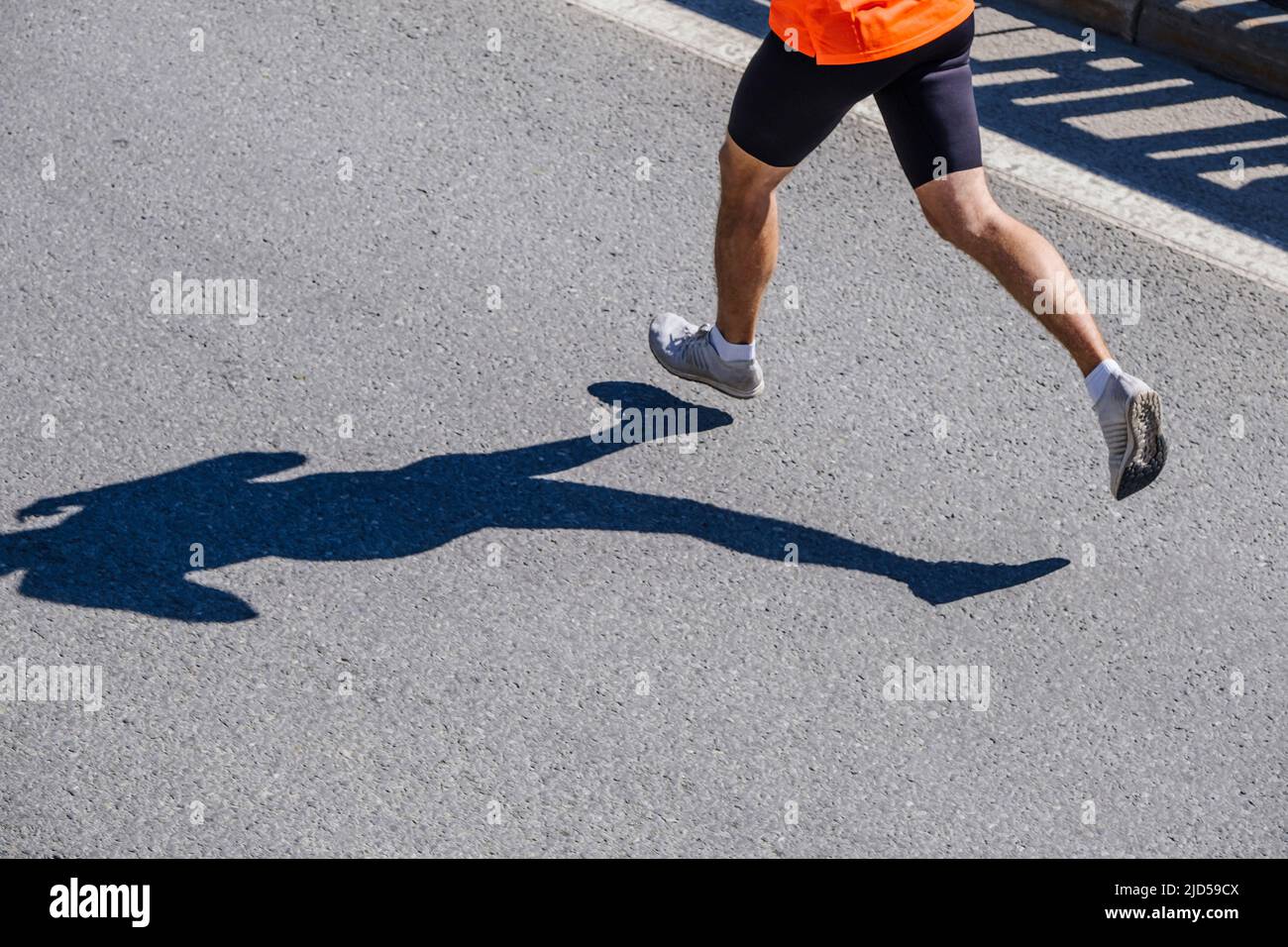 legs male running race. silhouette runner on asphalt Stock Photo - Alamy