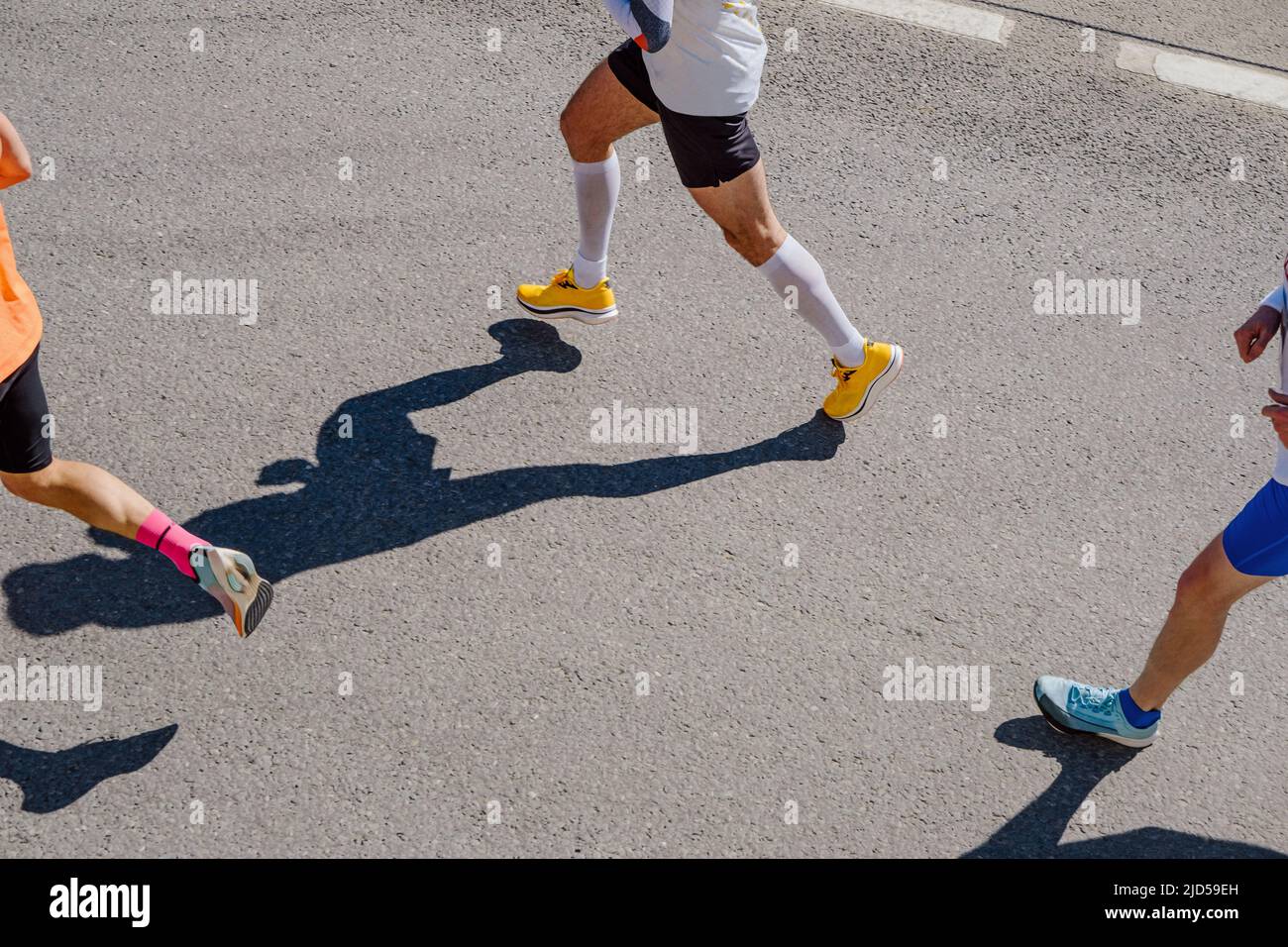 legs runners athletes run marathon race top view Stock Photo - Alamy