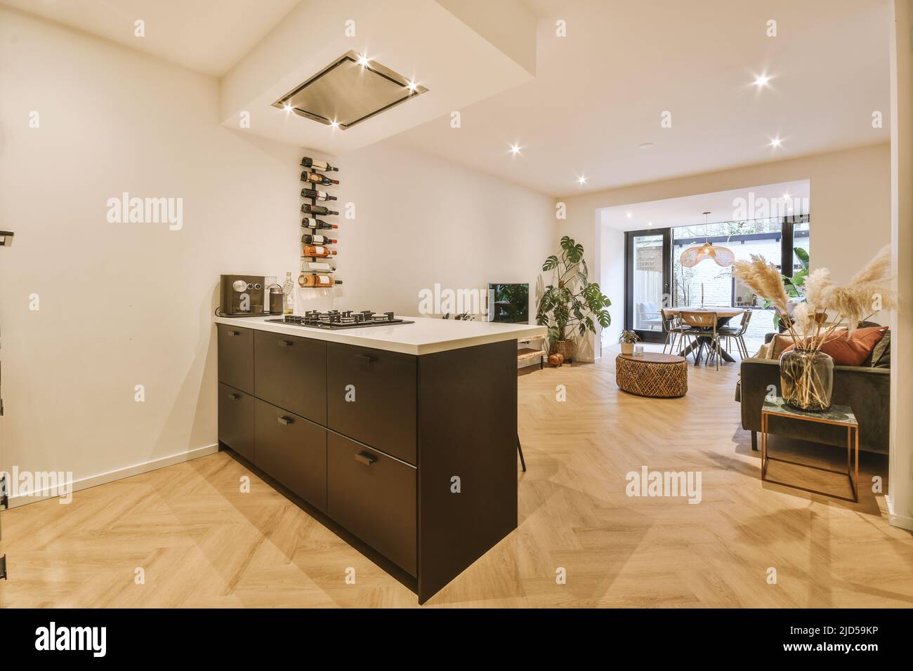 Counters with stove and oven located in modern kitchen near dining room ...