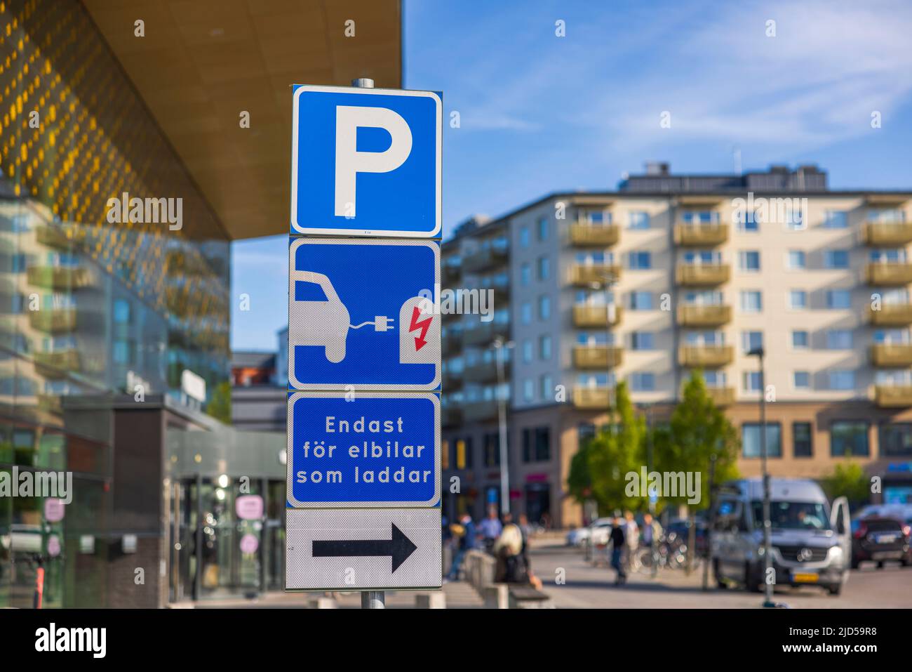 Close up view of parking sign for charging electric vehicles in parking ...