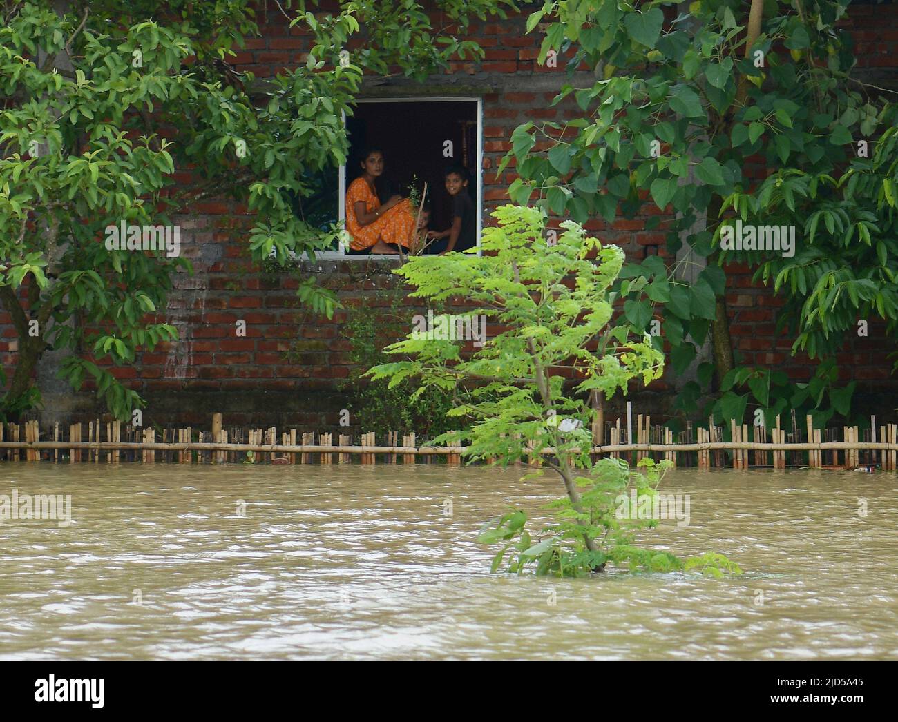 Agartala, India's northeastern state of Tripura. 18th June, 2022. People wait at home to get ...