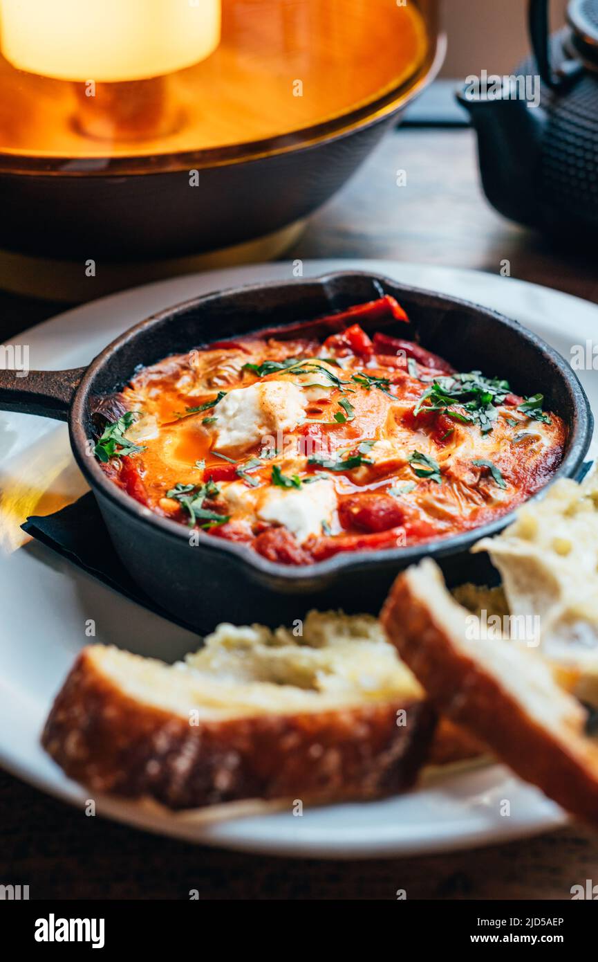 Traditional israeli shakshuka in frying hi-res stock photography and ...