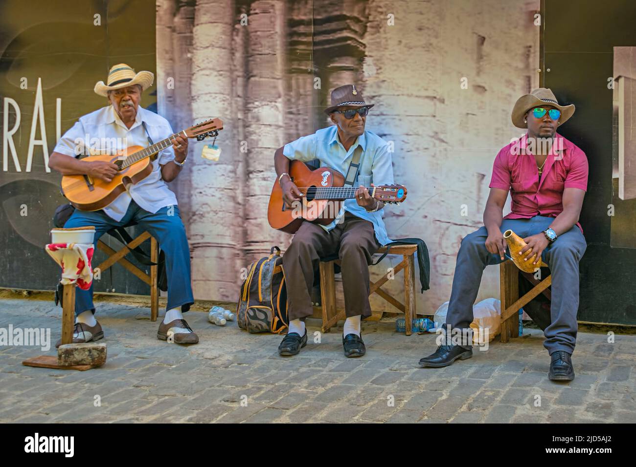Three street musicians, two with guitar, performing in Old Havana, Cuba ...