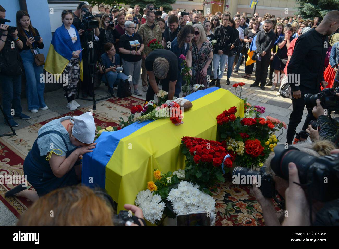 Kiev, Ukraine - June 18, 2022 - People pay their last respects to civil ...
