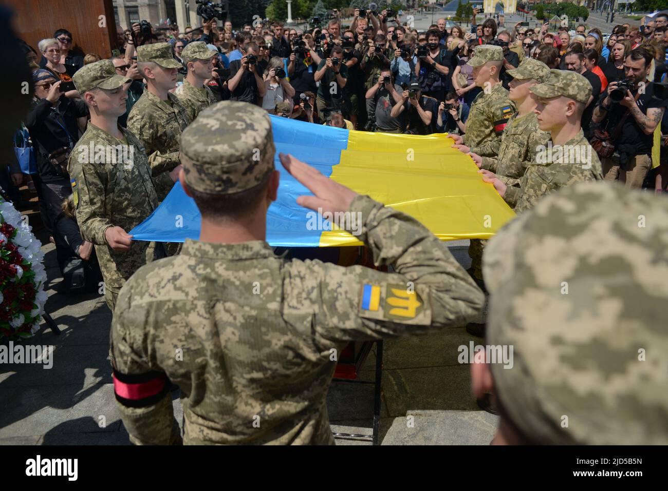 Kiev, Ukraine - June 18, 2022 - A soldier salutes as the coffin with ...
