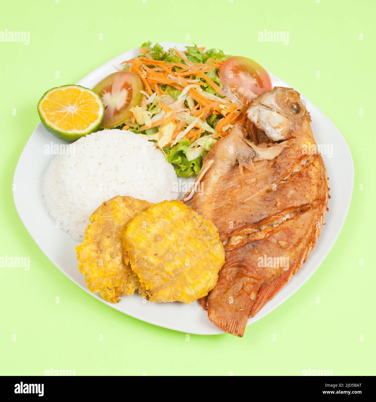 Fried fish - tilapia with white rice and fried plantains and salad ...