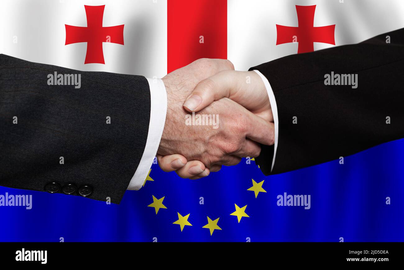 European Union and Georgia concept. Handshake on European and Georgian ...