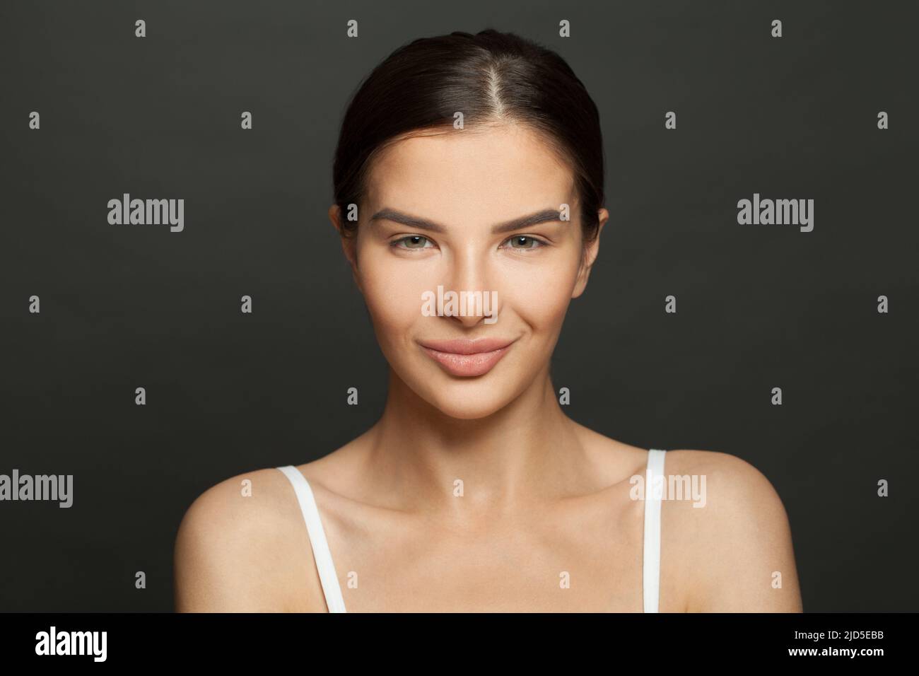 Beautiful young woman with clean fresh skin. Facial treatment ...