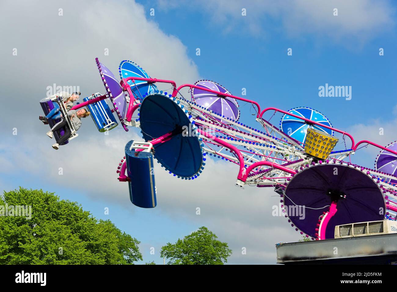 Children on a spinning fairground ride during the mayfair Stock Photo ...