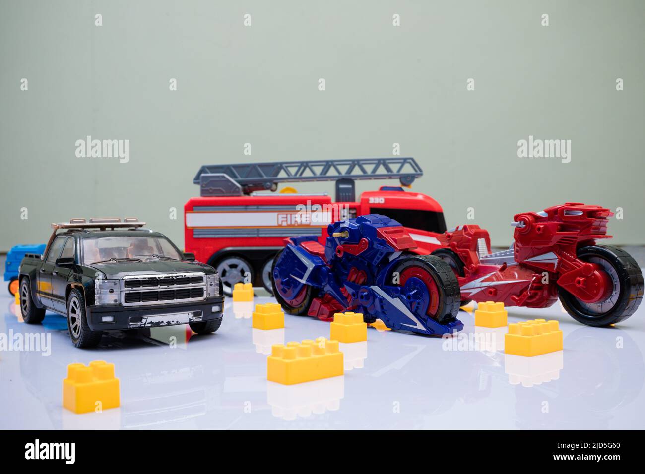 Toy cars trucks plastic vans on white background in Kenya East Africa ...