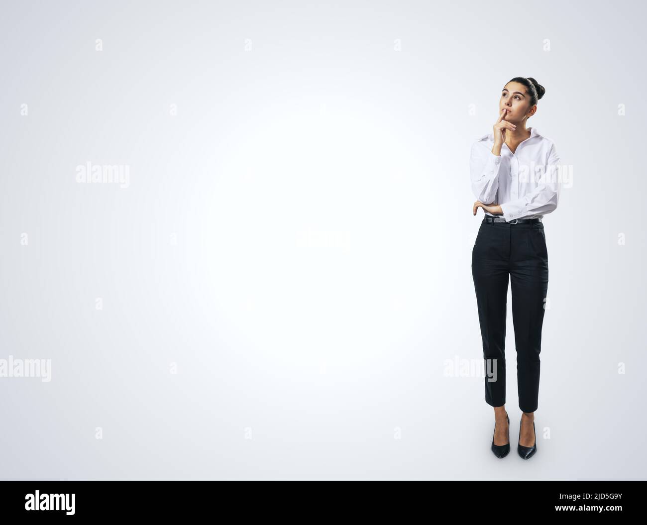 Thinking concept with pensive businesswoman in white shirt and dark ...