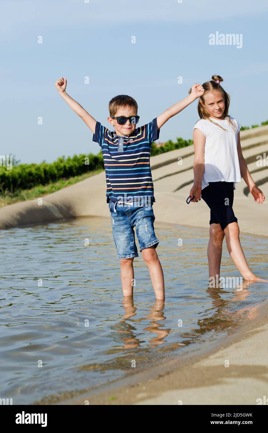 Kids laughing swim hi-res stock photography and images - Alamy