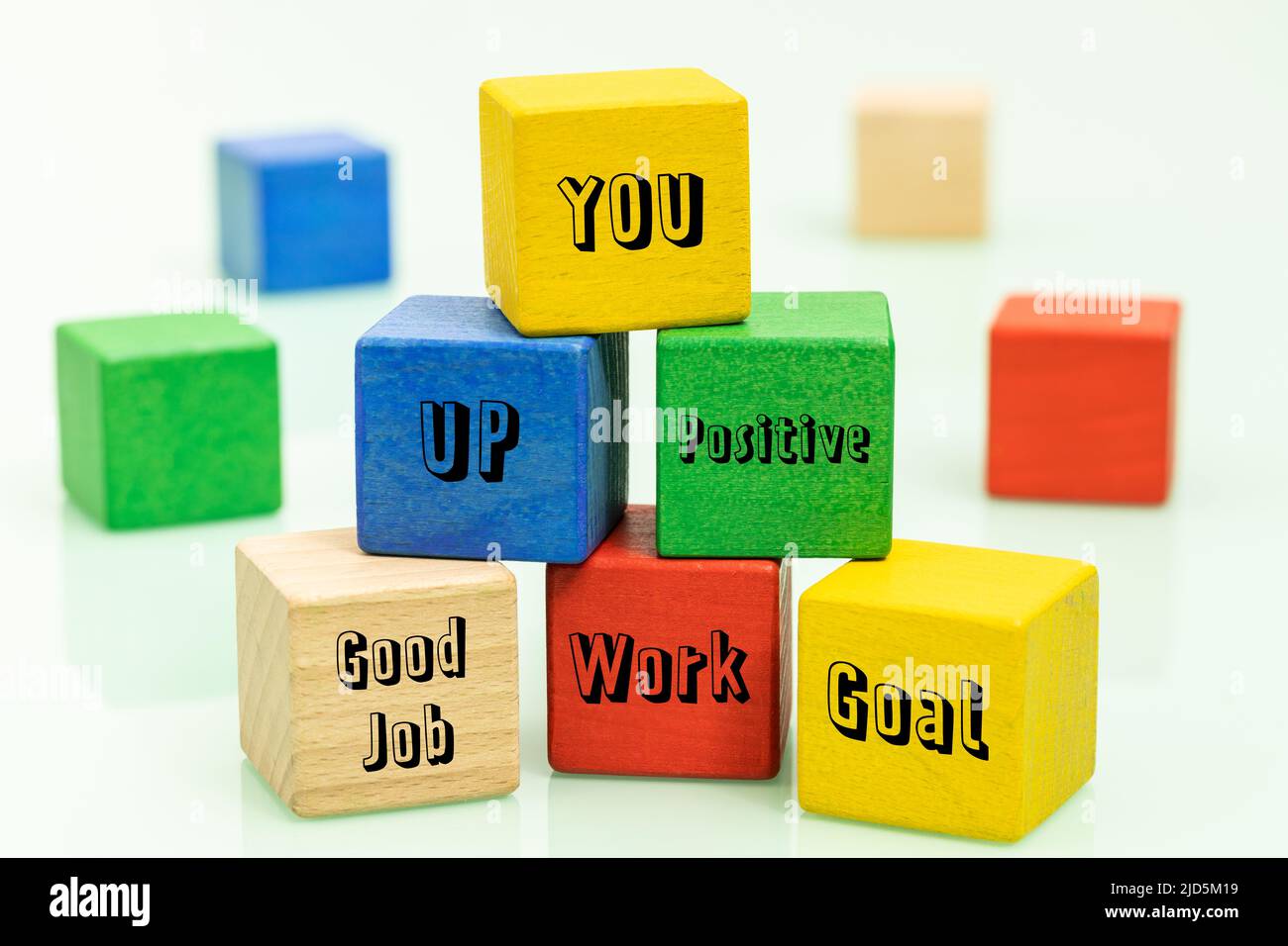 colorful wooden blocks with motivating words that encourage self ...