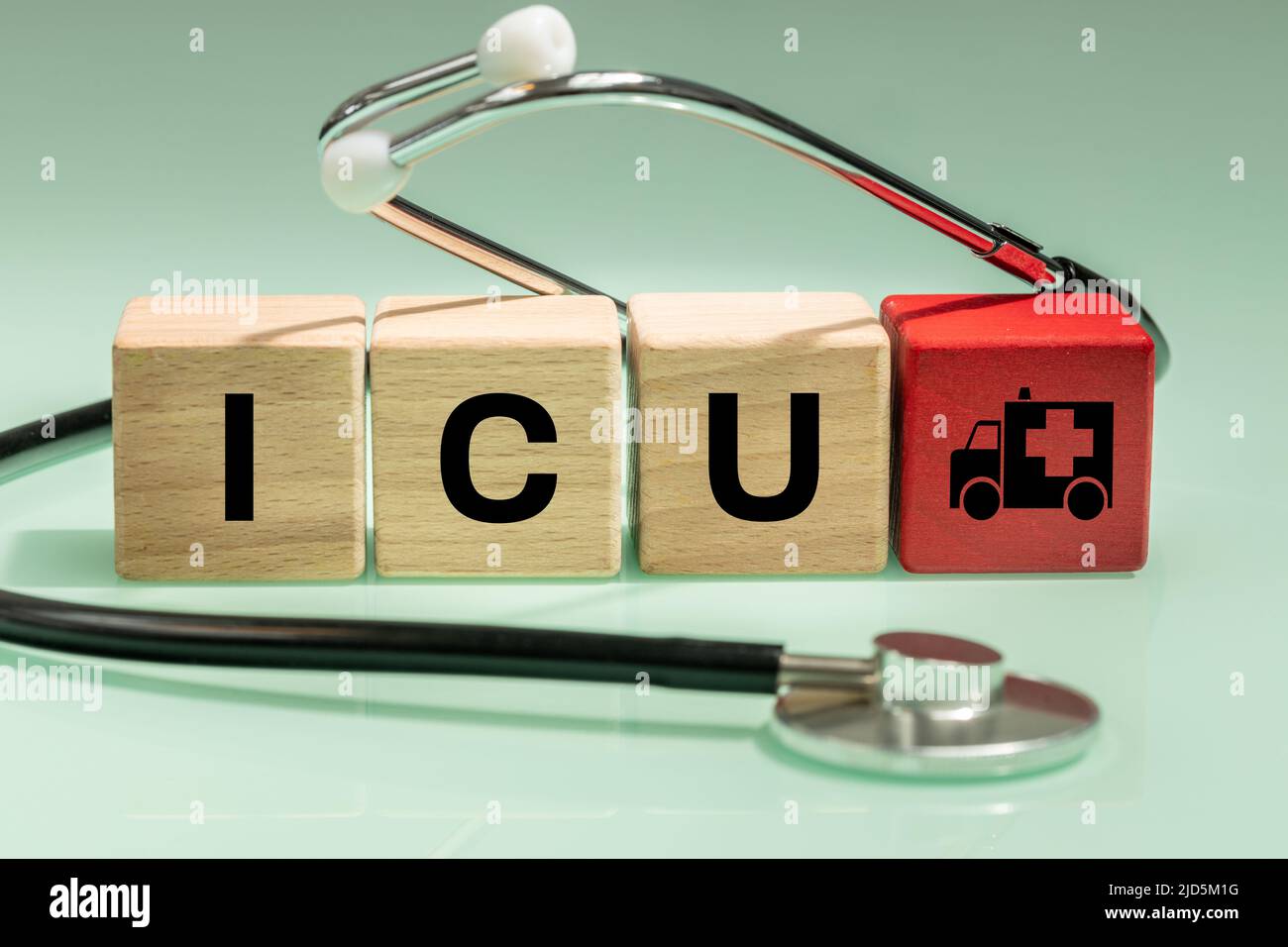 Medical stethoscope, wooden blocks with the words ICU intensive care ...