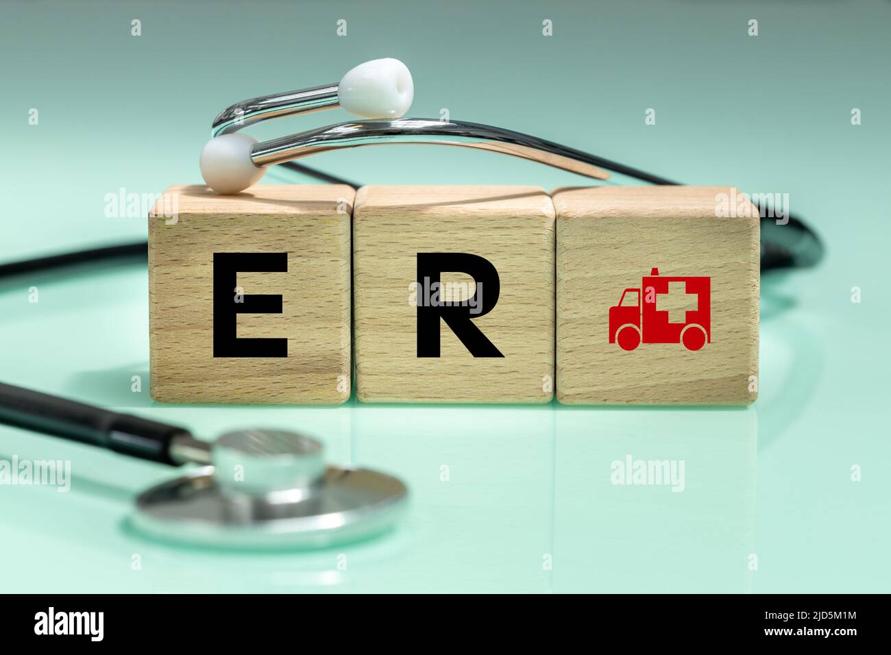 Medical stethoscope, wooden blocks with the inscription ER Emergency ...
