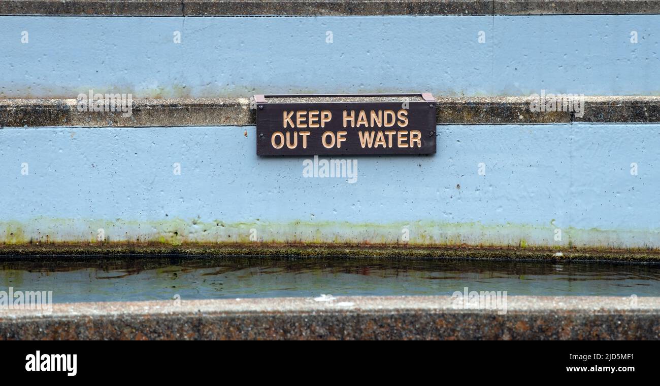 The sign is very clear and instructs people to keep their hands out of ...