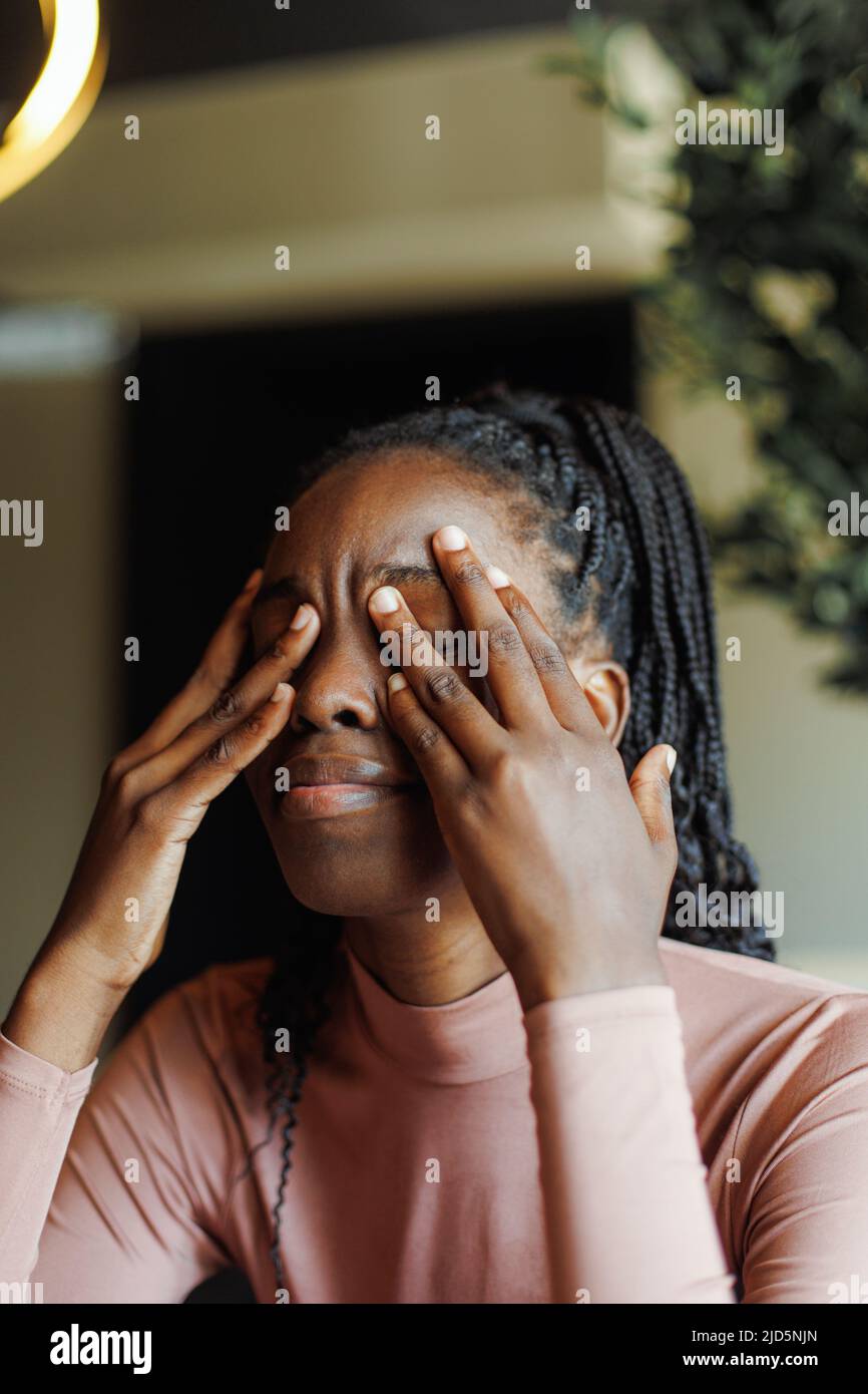 Young unhappy afro american woman with dreadlocks crying covering eyes ...